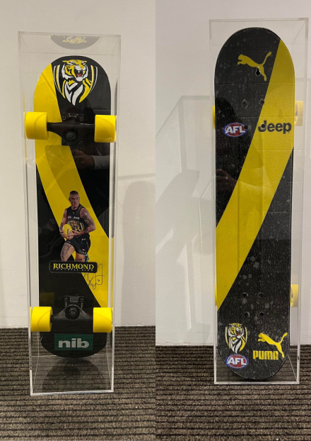Signed Dustin Martin Skateboard in Acrylic Case | AirAuctioneer
