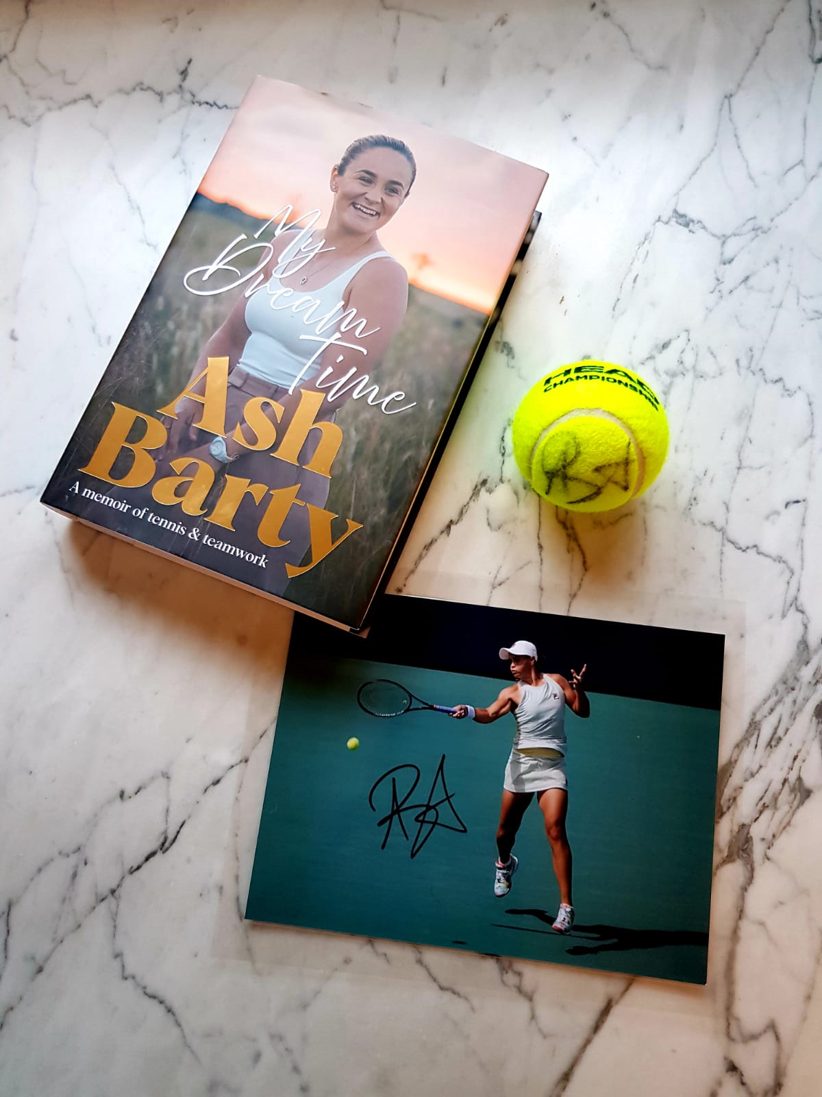 Ash Barty signed tennis ball, card and her book | AirAuctioneer