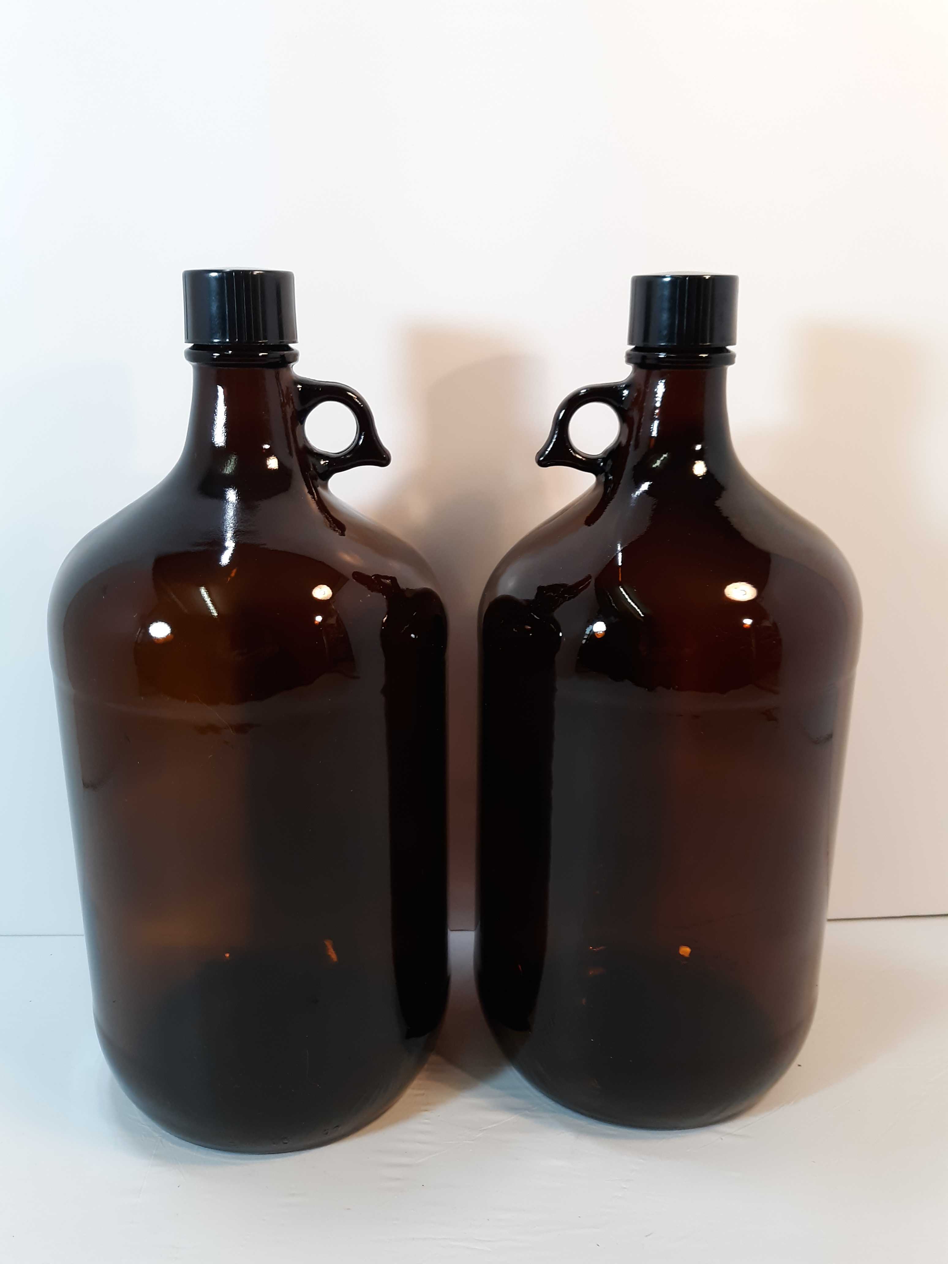 Two Amber Glass Gallon Jugs with Caps | AirAuctioneer
