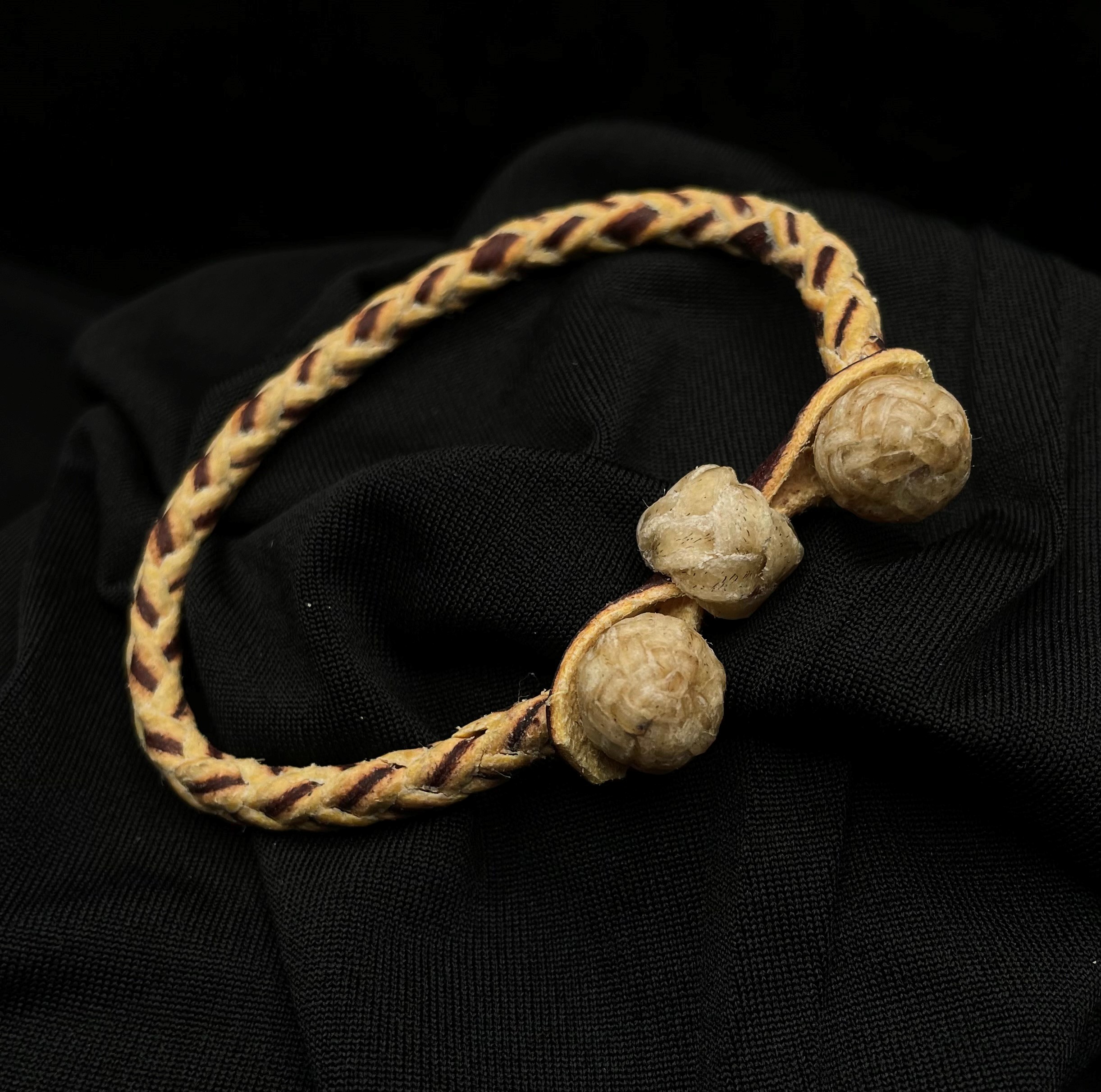 Braided Bracelet with Rawhide Buttons | AirAuctioneer